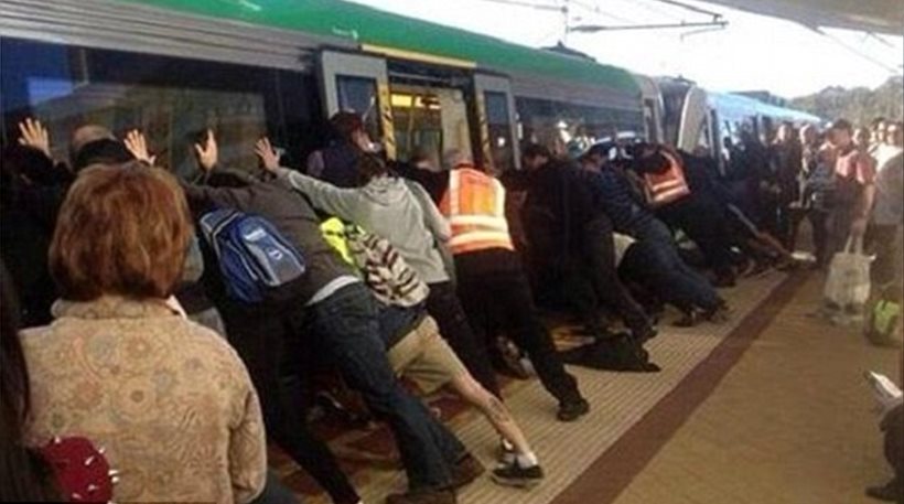 Unbelievable video: People push a train to help free a trapped man ...