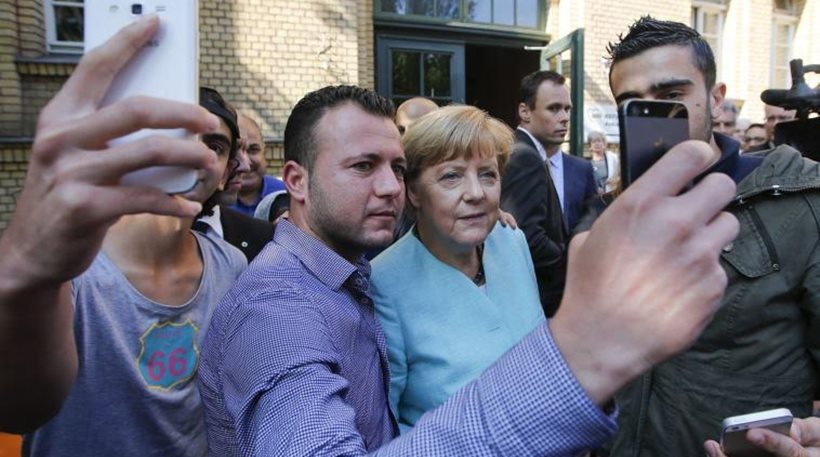 Merkel, 'Mother of all refugees' takes selfies with migrants in Berlin ...