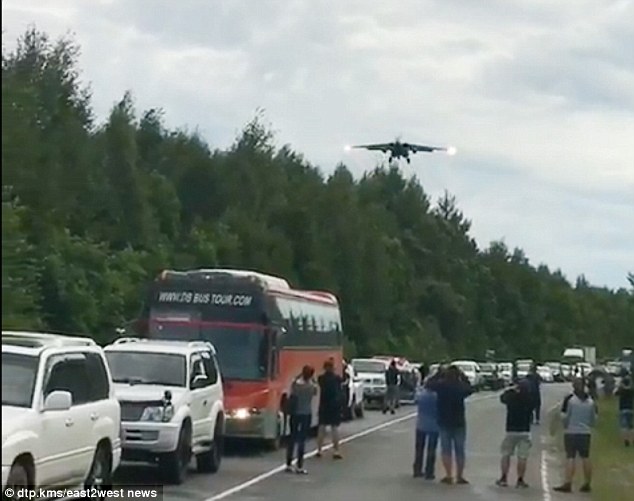 Warplanes thunder over stunned motorists after Russian Air Force turns ...