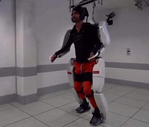 Paralyzed man walks using brain-controlled robotic suit (photos ...