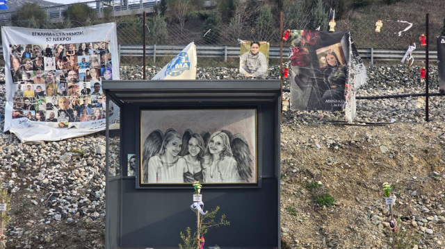 Flowers left by relatives of the victims at the site of the tragedy in ...