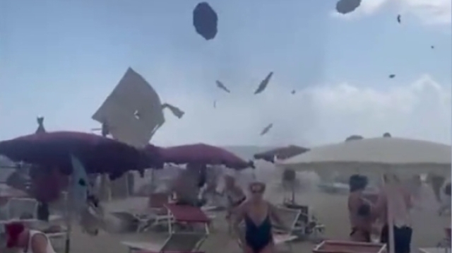 Sudden tornado on a beach in central Italy - Umbrellas and sunbeds in ...